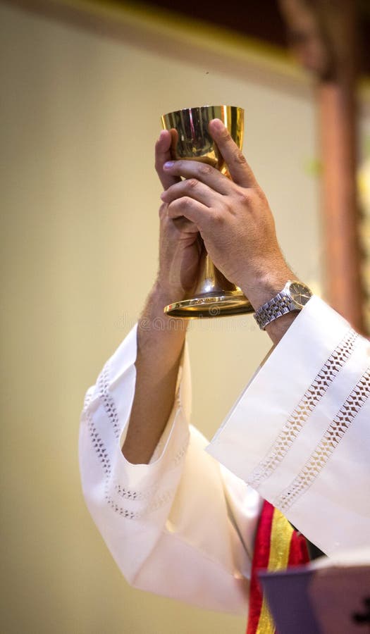 Priest consecrating ostia stock image. Image of male - 96782507