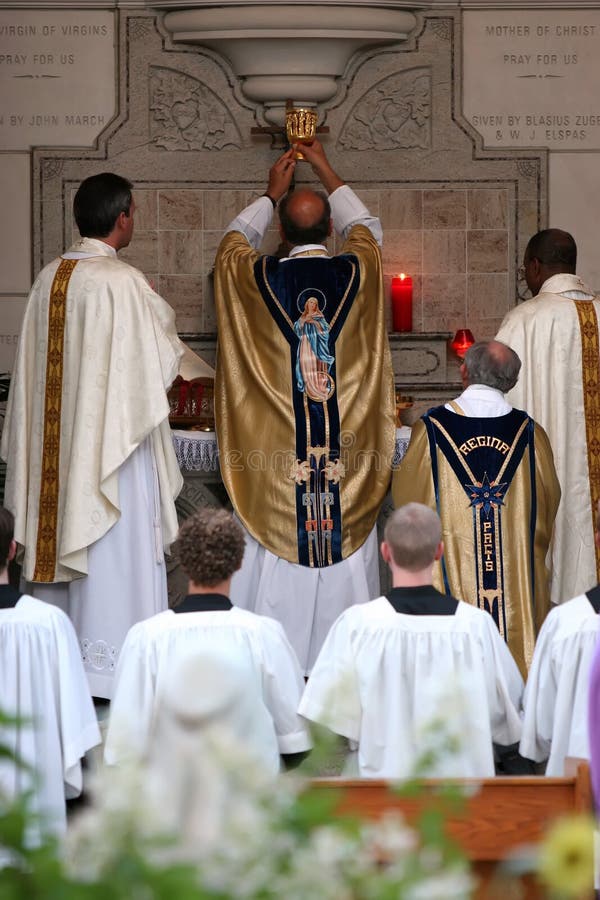 Priest Consecrating Wine at Mass Stock Image - Image of church ...