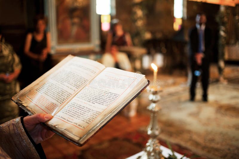 Priest Holding Bible in Church Stock Photo - Image of chapel, cathedral ...