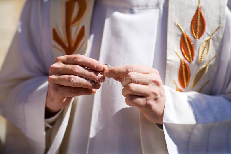 Priest Holding Wedding Rings Stock Image - Image of hands, ceremonial ...