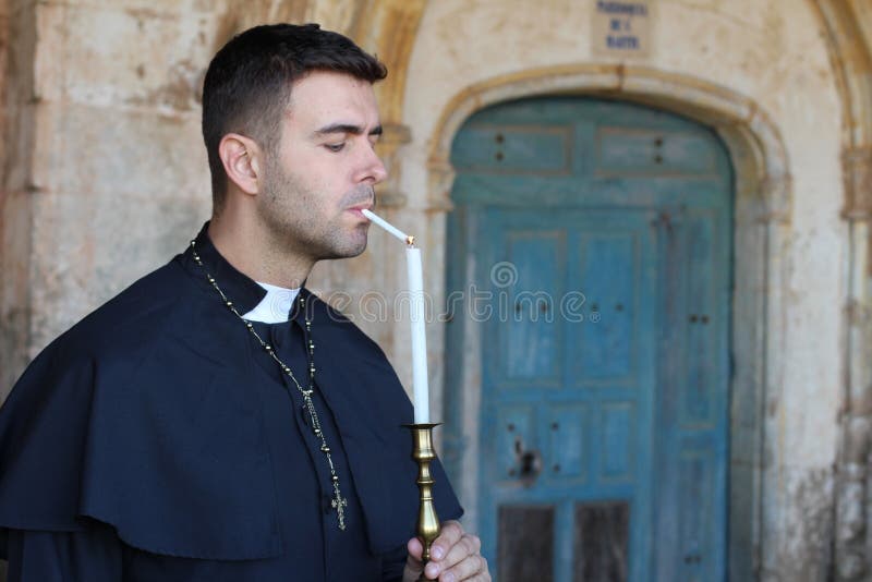 Priest Lighting a Cigarette with a Candle Stock Photo - Image of ...