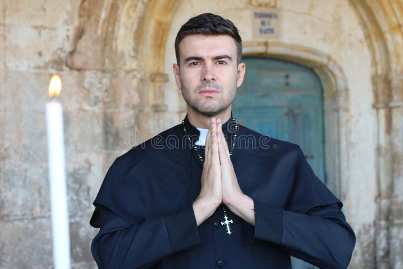 Priest Praying with a Candle Light Stock Photo - Image of caucasian ...