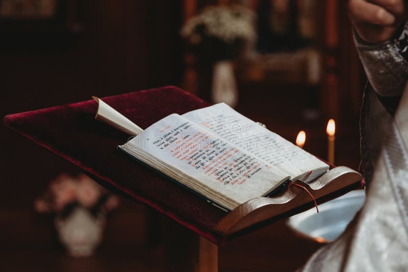 Priest reading from bible stock image. Image of gospel - 250829541