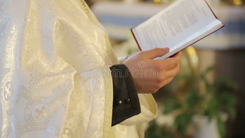 Priest Reading the Bible in Church. Priest Shatters the Scriptures Holy ...