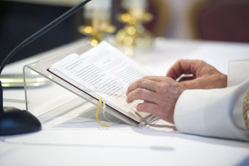 Priest reading a bible stock image. Image of bands, cross - 92646311
