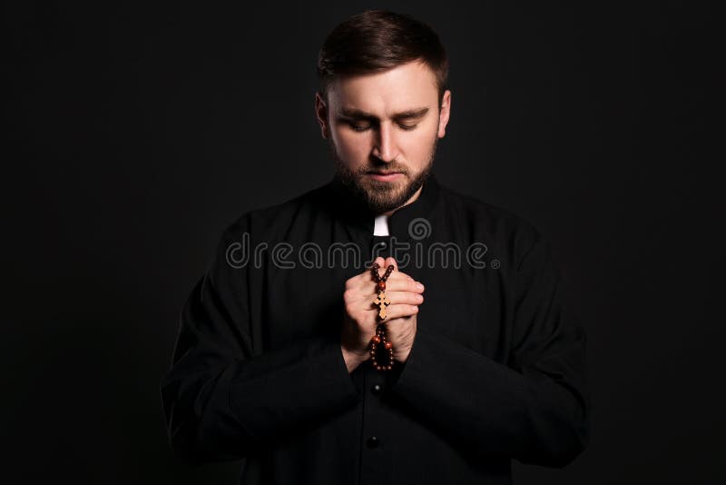 Priest with Rosary Beads Praying on Black Background Stock Image ...