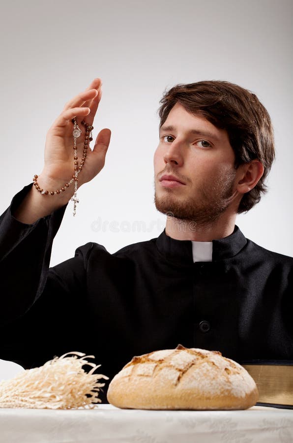 Priest with Rosary, Bread and the Bible Stock Image - Image of prayer ...