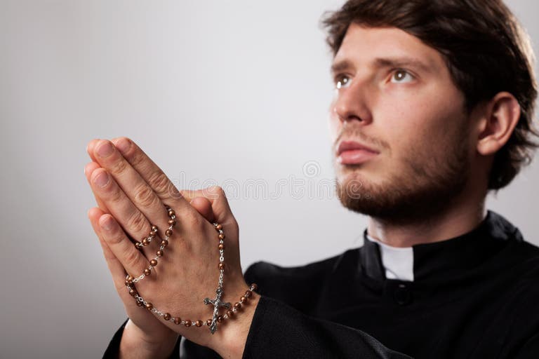 Priest with rosary stock image. Image of priest, religion - 36573991