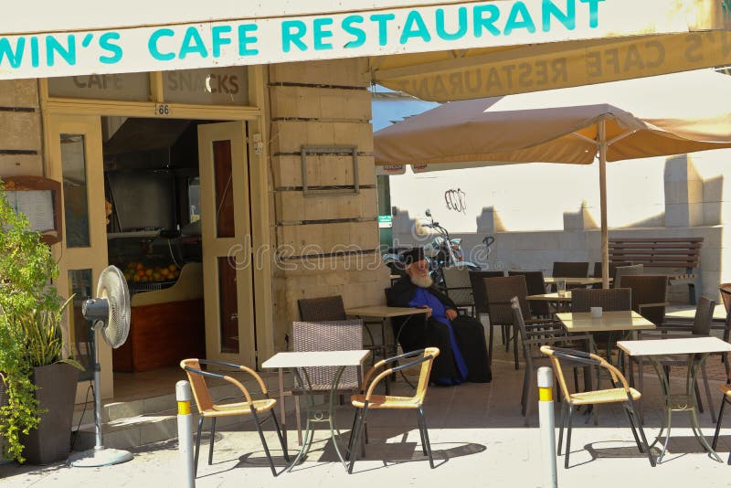 Priest Sitting in an Open-air Restaurant and Waiting Editorial ...