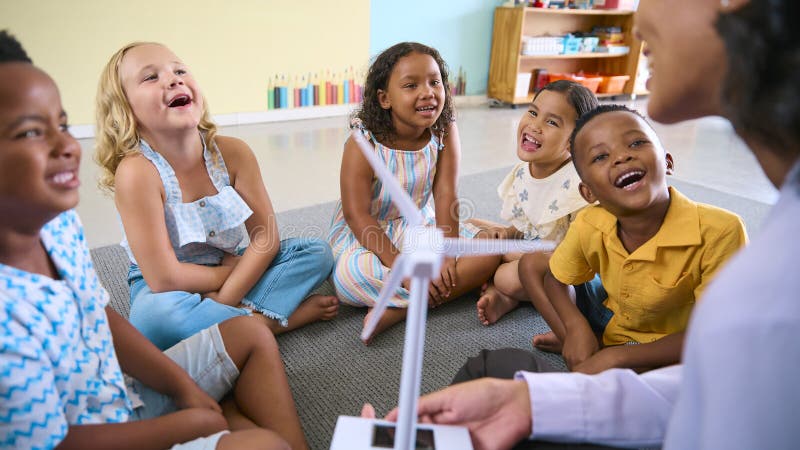 Primary or Elementary School Class with Teacher and Model Wind Turbine ...