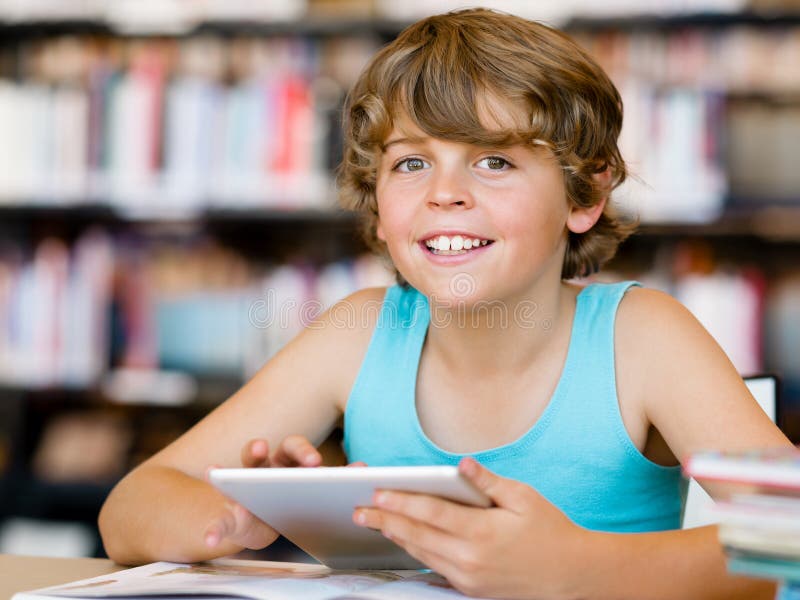Primary School Boy with Tablet in Library Stock Image - Image of person ...