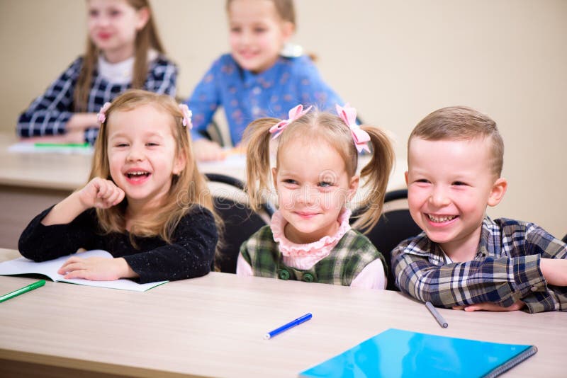 Primary School Children Work Together in Class. Stock Image - Image of ...