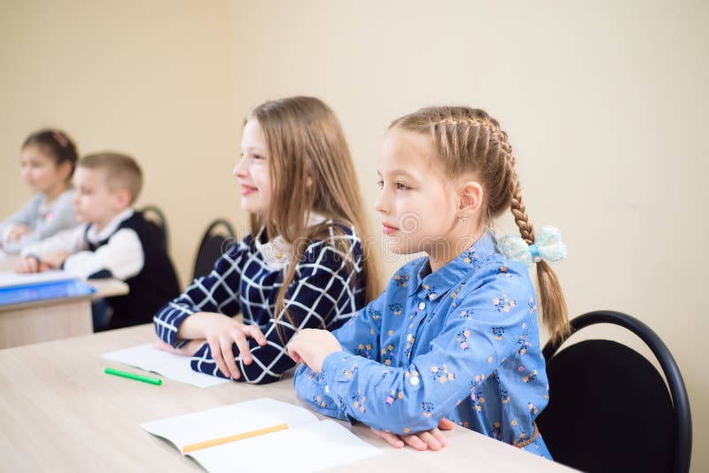 Primary School Children Work Together in Class. Stock Photo - Image of ...