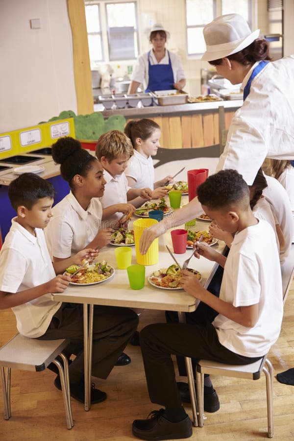 Primary School Kids Eat Lunch in School Cafeteria, Vertical Stock Photo ...