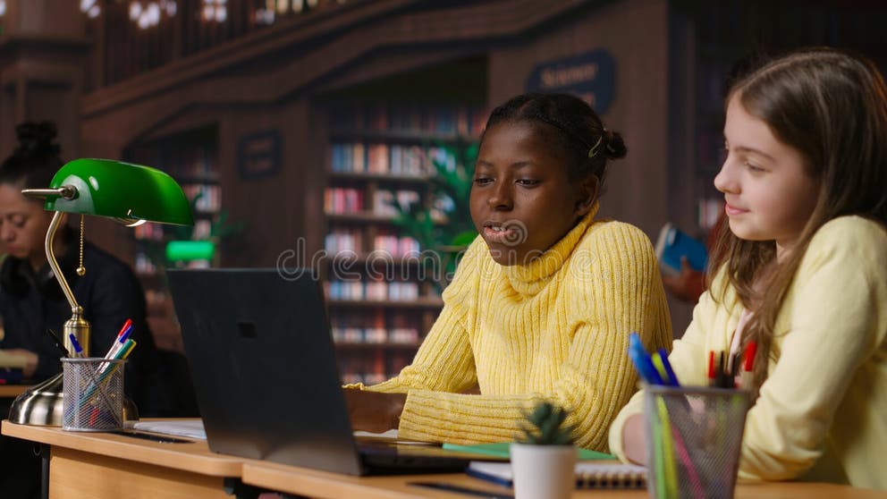 Primary School Pupils in a Library Discuss during an Online Seminar ...