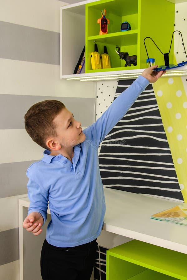 A Primary School Student Doing Homework in His Room. Stock Image ...