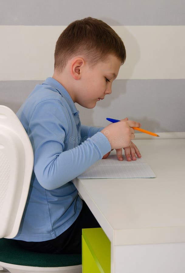 A Primary School Student Doing Homework in His Room. Stock Image ...
