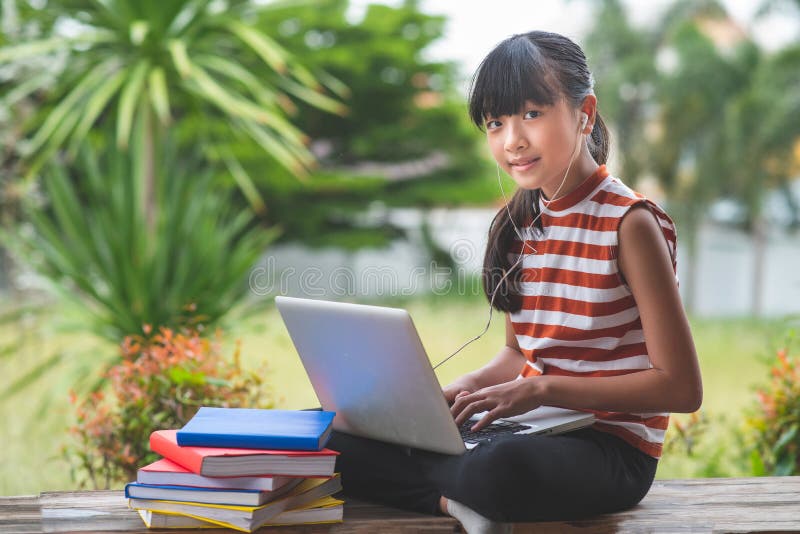Primary School Students in Asia Sit and Study at a Distance from Home ...