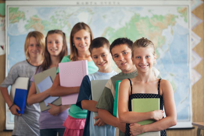 Primary School Students in the Classroom Stock Photo - Image of book ...