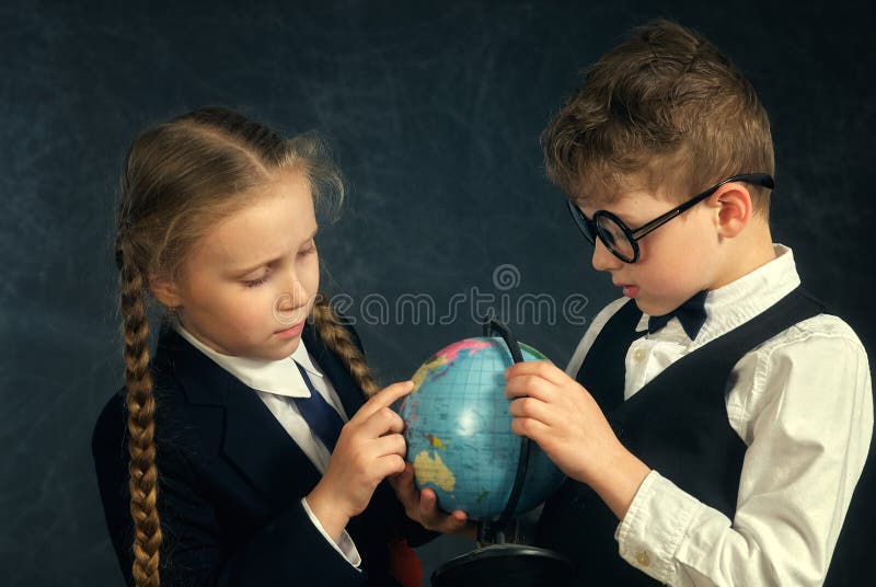 Elementary School Student with a Model of the Earth . Stock Photo ...