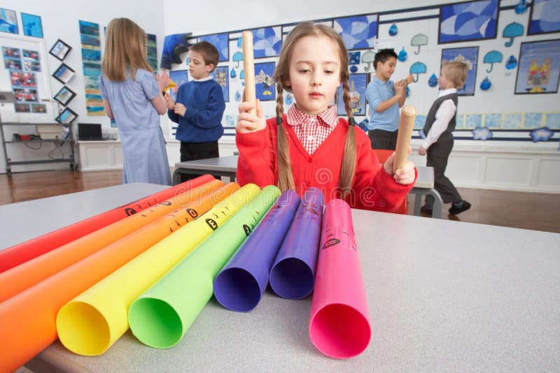 Primary Schoolchildren Having Music Lesson Stock Photo - Image of ...
