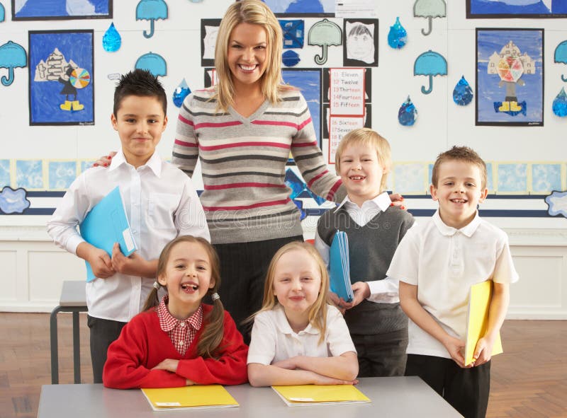 Female Primary School Pupil and Teacher Working Stock Image - Image of ...