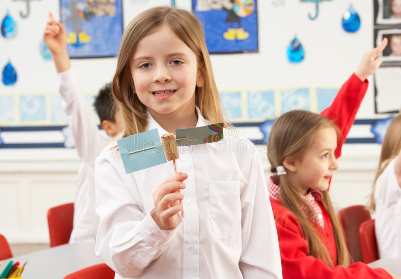 Primary Schoolchildren and Teacher Having a Lesson Stock Image - Image ...