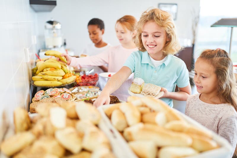 Primary Students Get Fruit at the Buffet Stock Photo - Image of ...
