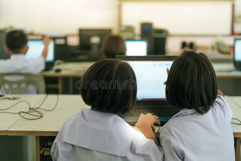 Primary Students Study by Computer Editorial Stock Image - Image of ...