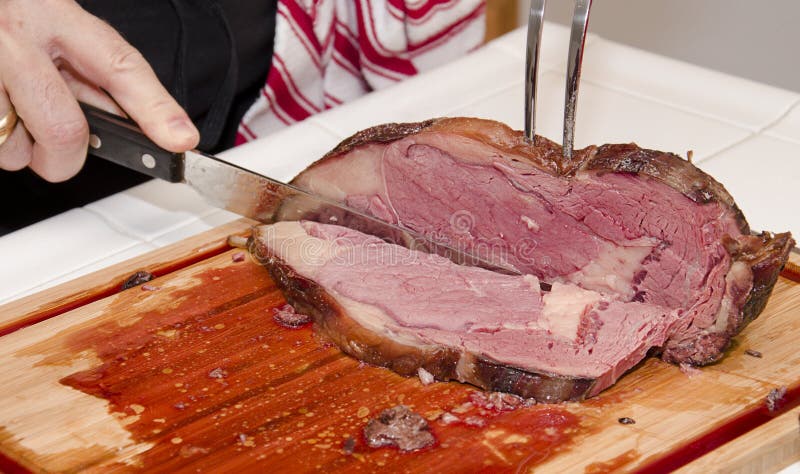 Prime rib being carved stock photo. Image of delicious - 19907134