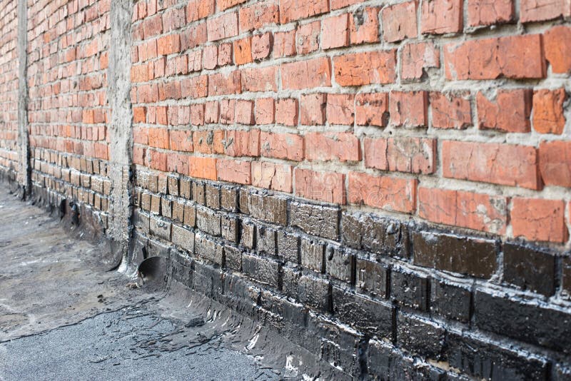 Priming brick wall stock photo. Image of bitumen, contractor - 78419836