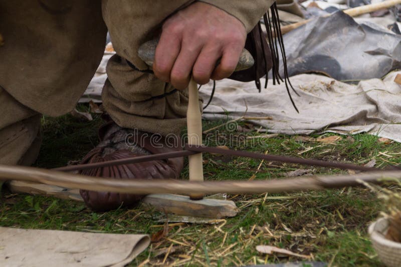 Primitive man makes fire stock photo. Image of primal - 183937410