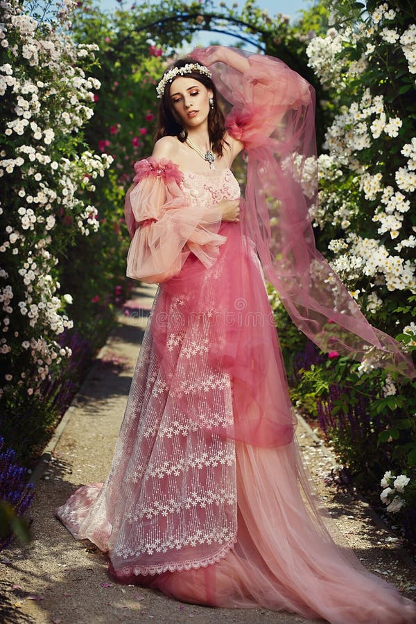 Princess in a Magic Rose Garden Stock Photo - Image of blooming, dress ...