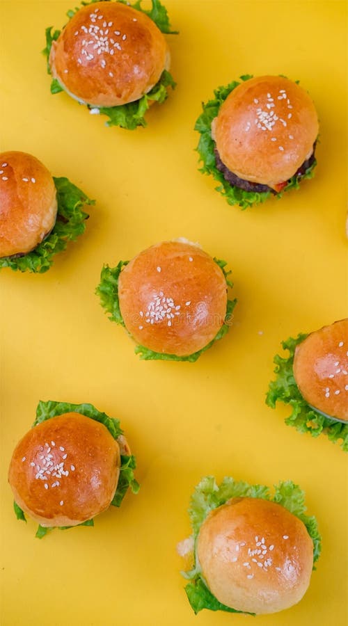 Top View of Unfocused Mini Burgers Isolated on Yellow Background Stock ...