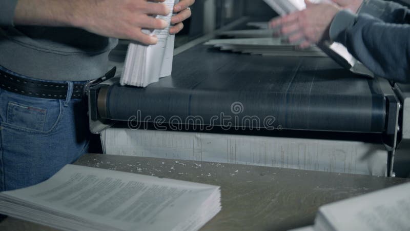 Workers Piling Paper on a Conveyor, Close Up. Stock Footage - Video of ...