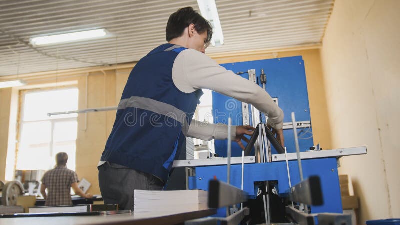 The Print Operator Puts a Sheet of Paper Stock Photo - Image of ...