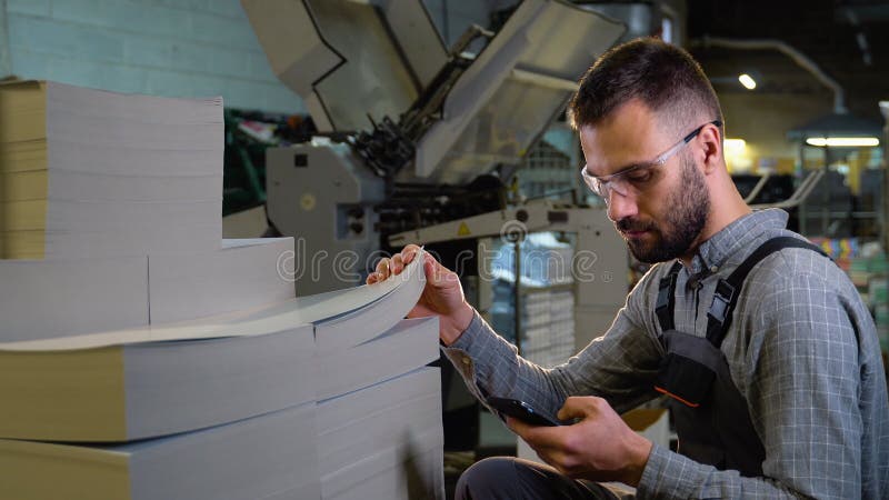 Print Worker Ready To Place Blank Sheets of Paper into Offset Machine ...