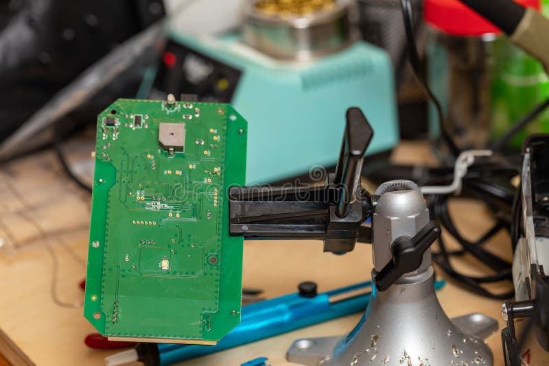 Printed Circuit Board in Vice on Workbench Stock Photo - Image of ...