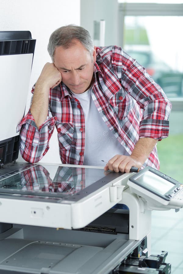 Printer Checking Print Run at Table Stock Photo - Image of cover ...
