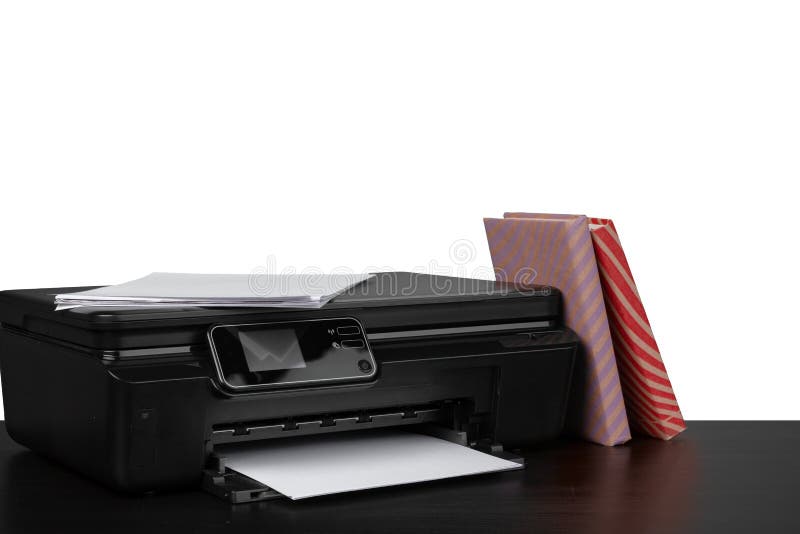 Printer and Stack of Books on Black Table Against White Background ...