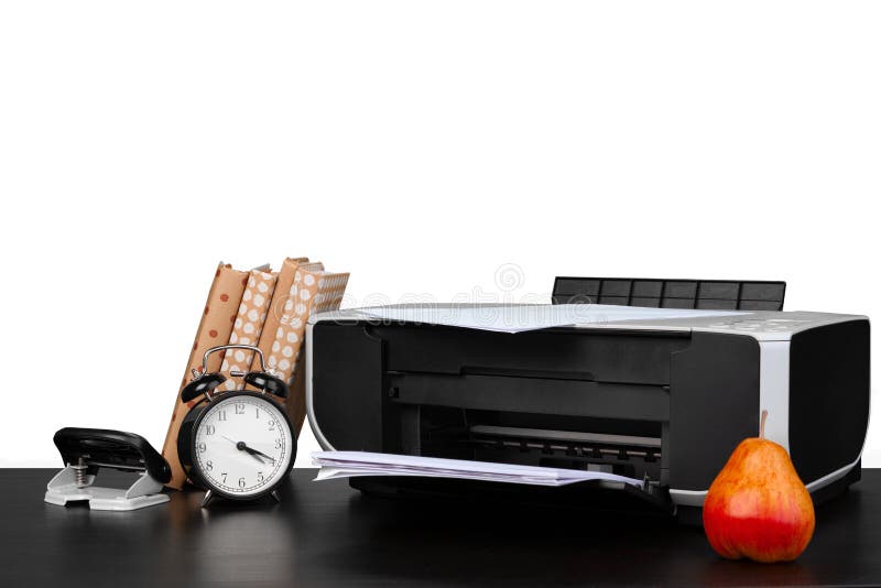 Printer and Stack of Books on Black Table Against White Background ...
