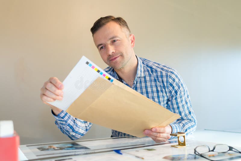 Printer Worker Checking Finished Paper Stock Photo - Image of interior ...