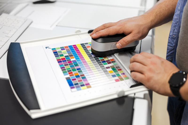 Printing Factory Worker with Color Reference Card Stock Image - Image ...