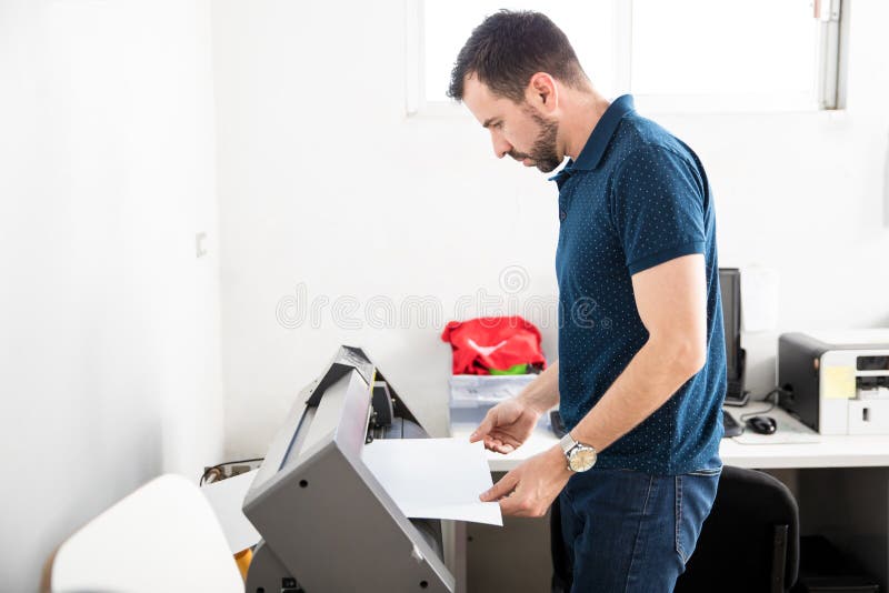 Printing Labels for a Serigraph Press Stock Photo - Image of handsome ...