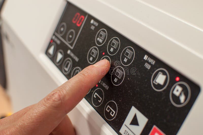 Printing Machine Control Panel with Start Buttons. Worker`s Hand ...