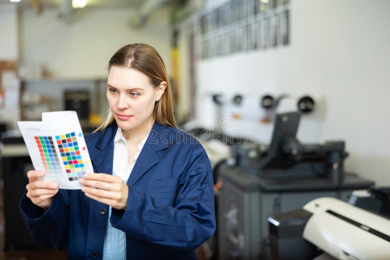 Printing Office Worker Examining Test Page for Printer Stock Photo ...