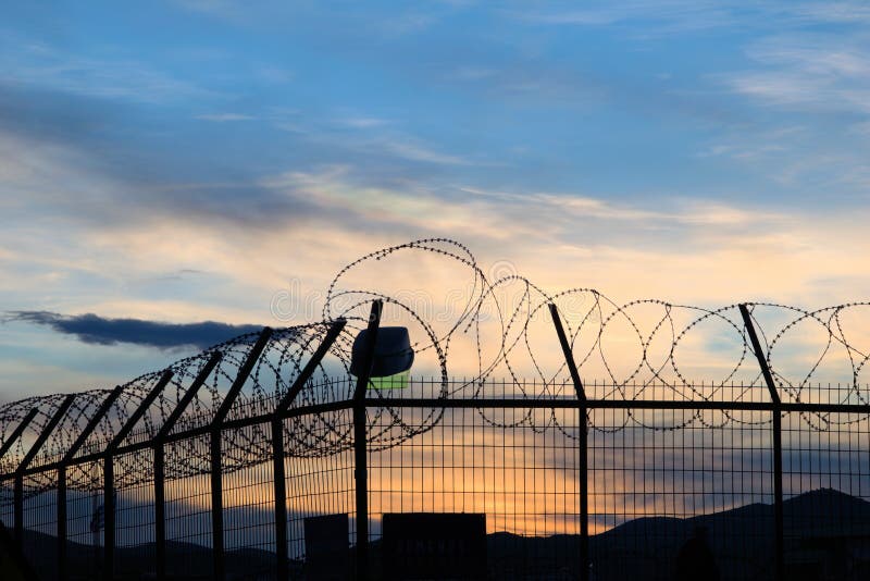 Prison Barbed Wire, at Sunset, Depression Stock Photo - Image of ...