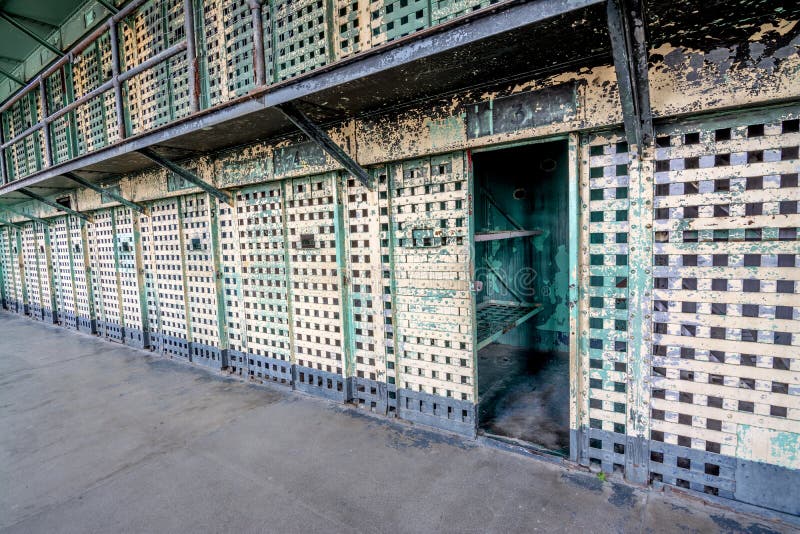 Prison Cell Block of Barred Doors and One is Open Stock Image - Image ...