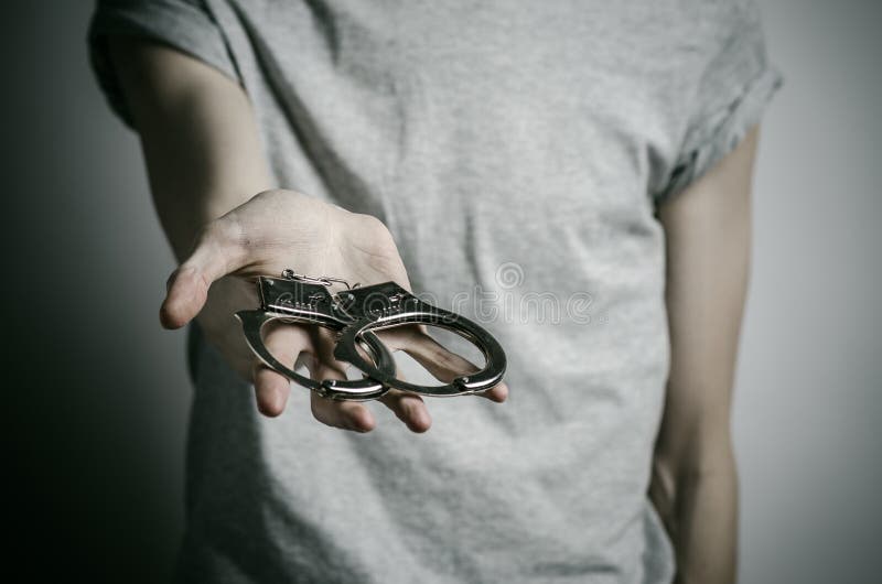 Prison and Convicted Topic: Man Hands with Handcuffs Isolated on White ... Prison and Convicted Topic: Man Hands with Handcuffs Isolated on White ...