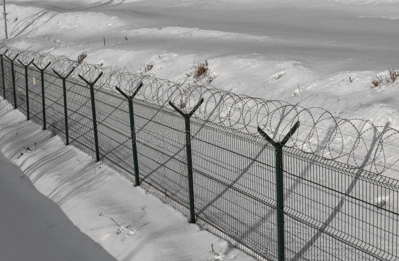 Prison Fence in Winter Time Stock Photo - Image of freedom, control ...